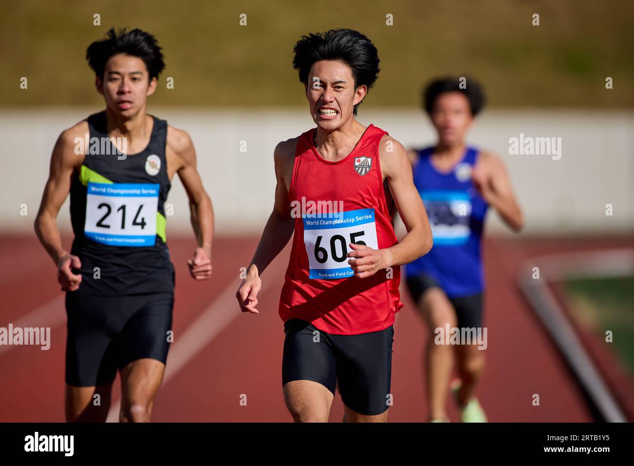 Japanese athletes running on track Stock Photo - Alamy
