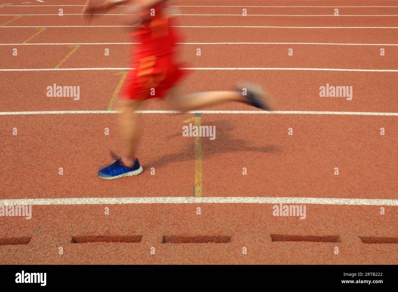 Long distance runners are running on the track Stock Photo - Alamy