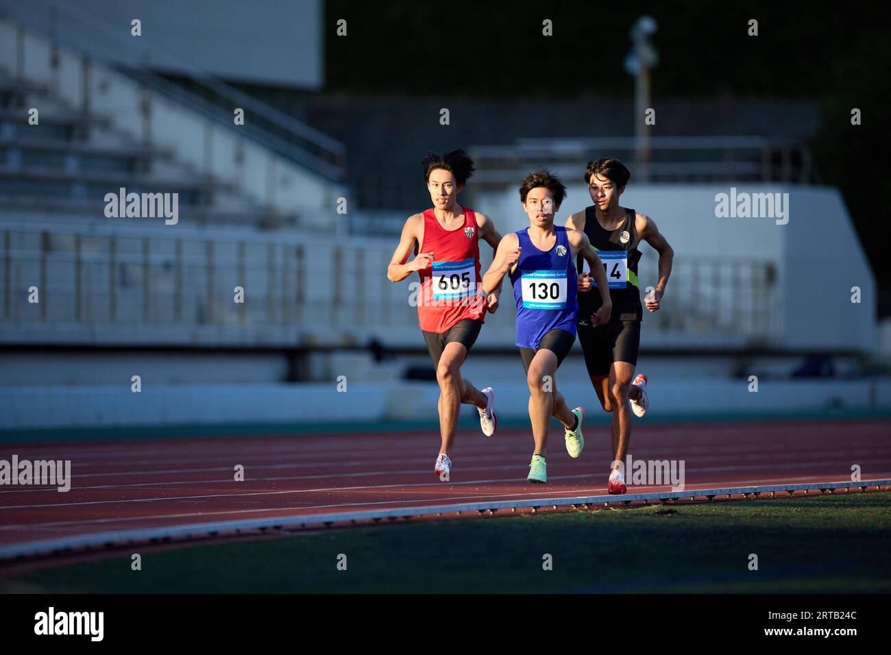 Japanese athletes running on track Stock Photo - Alamy