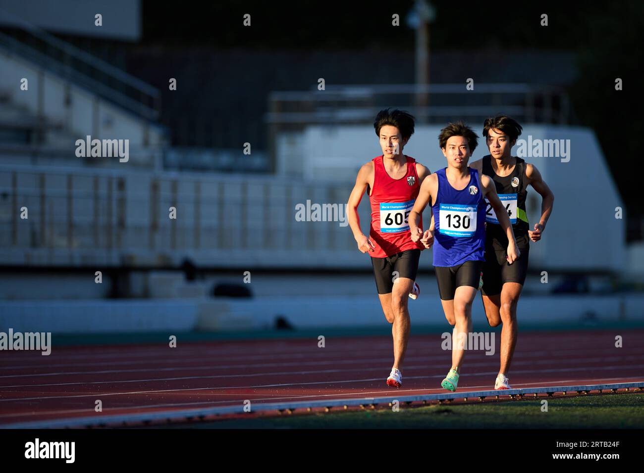 Japanese athletes running on track Stock Photo - Alamy