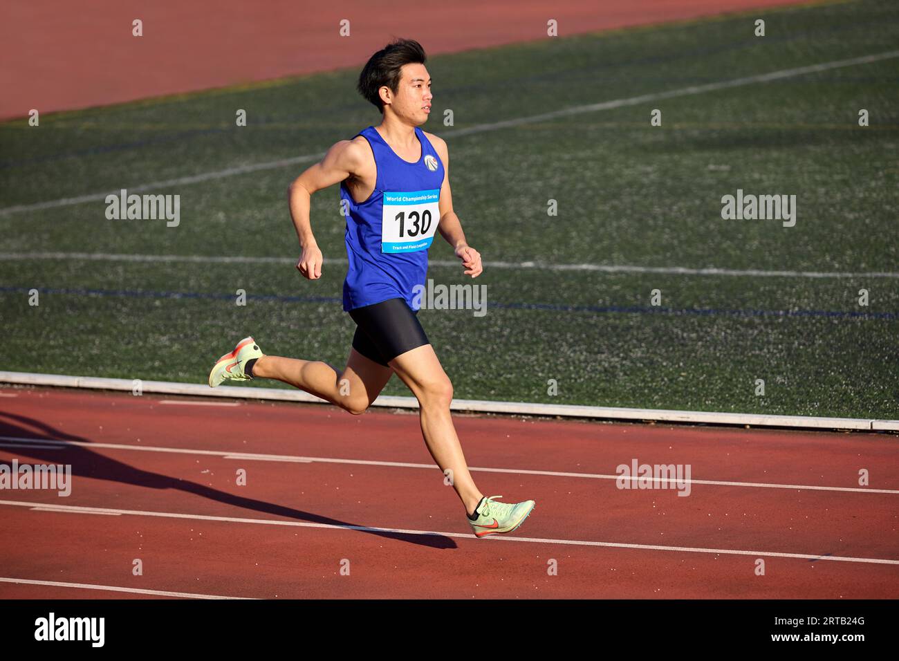 Japanese athlete running on track Stock Photo - Alamy