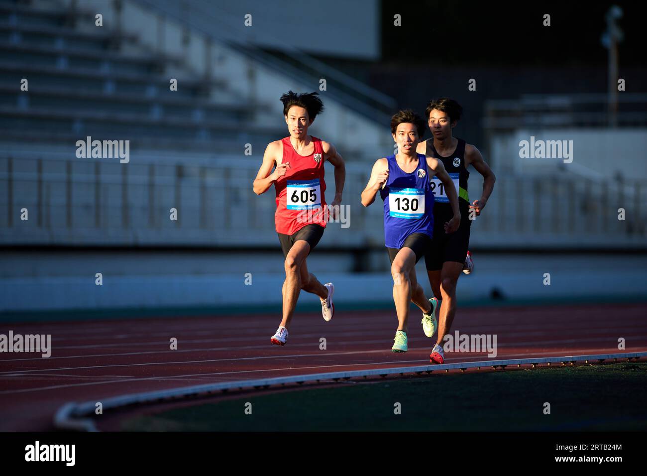 Japanese athletes running on track Stock Photo - Alamy