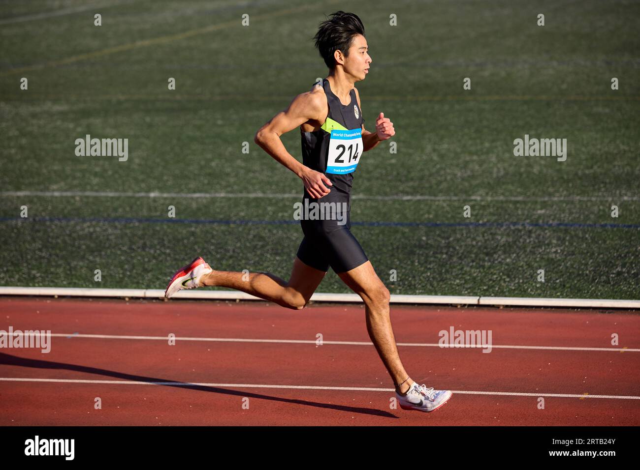 Japanese athlete running on track Stock Photo - Alamy