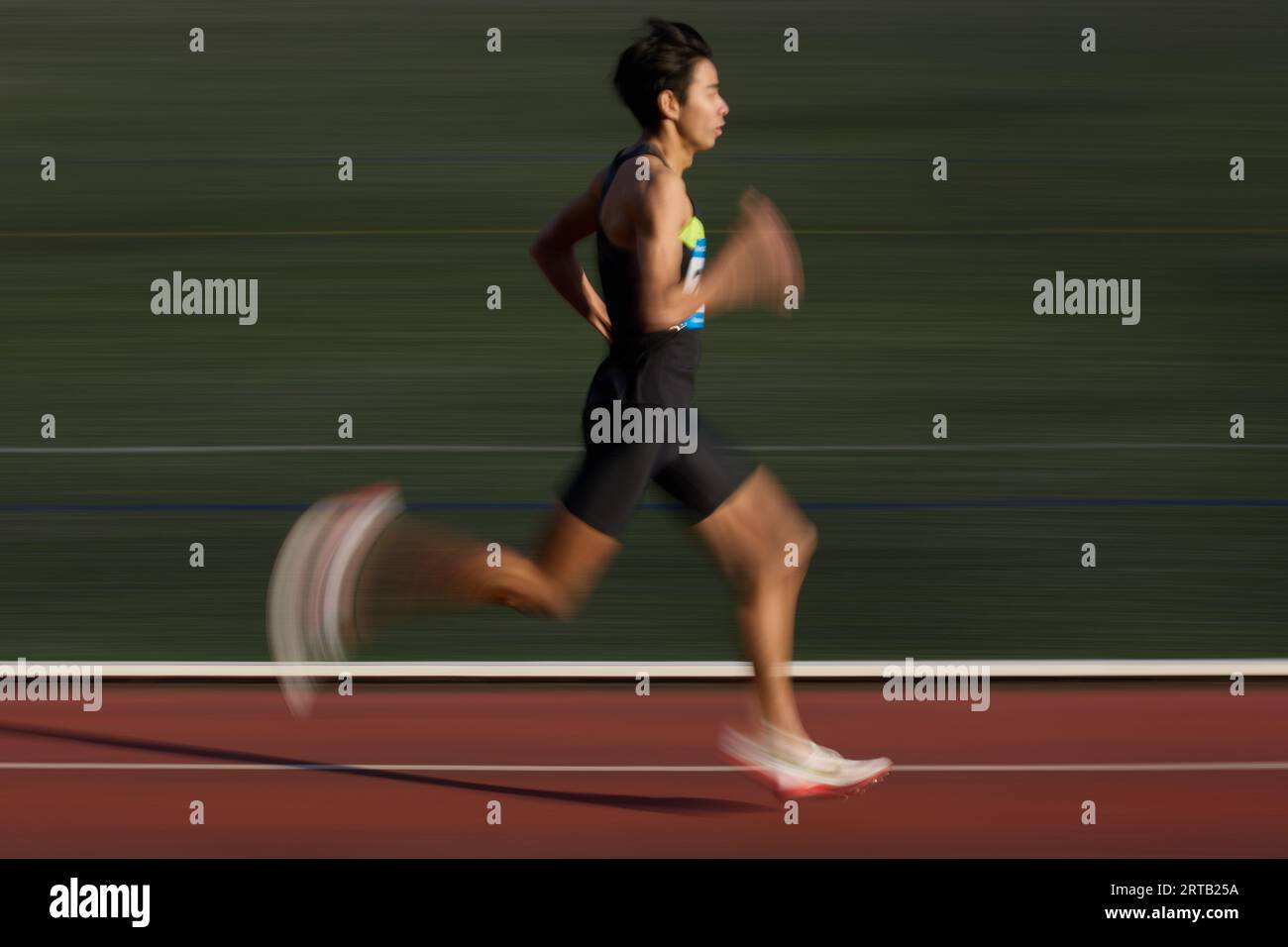 Japanese athlete running on track Stock Photo - Alamy