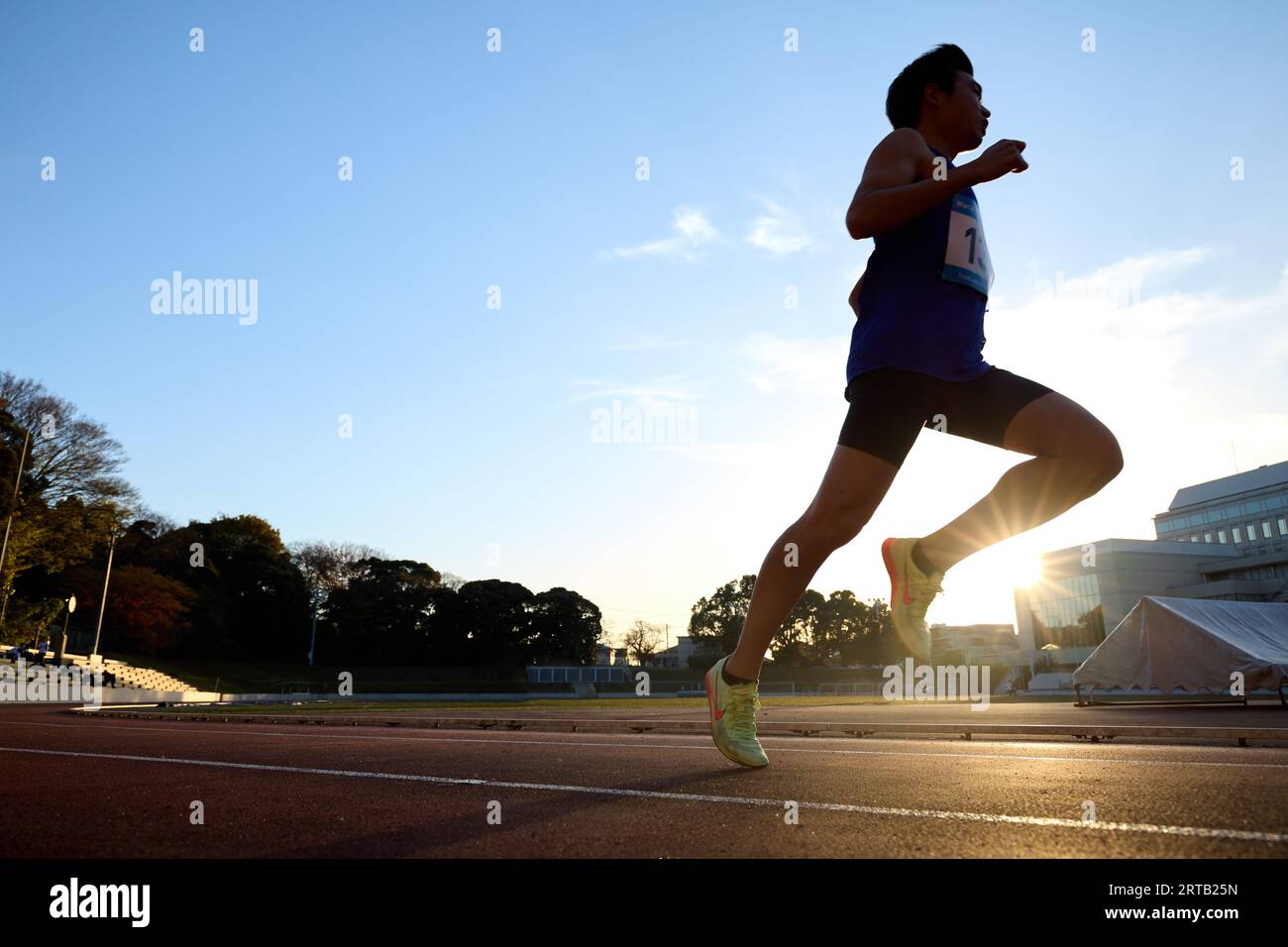 Japanese athlete running on track Stock Photo - Alamy