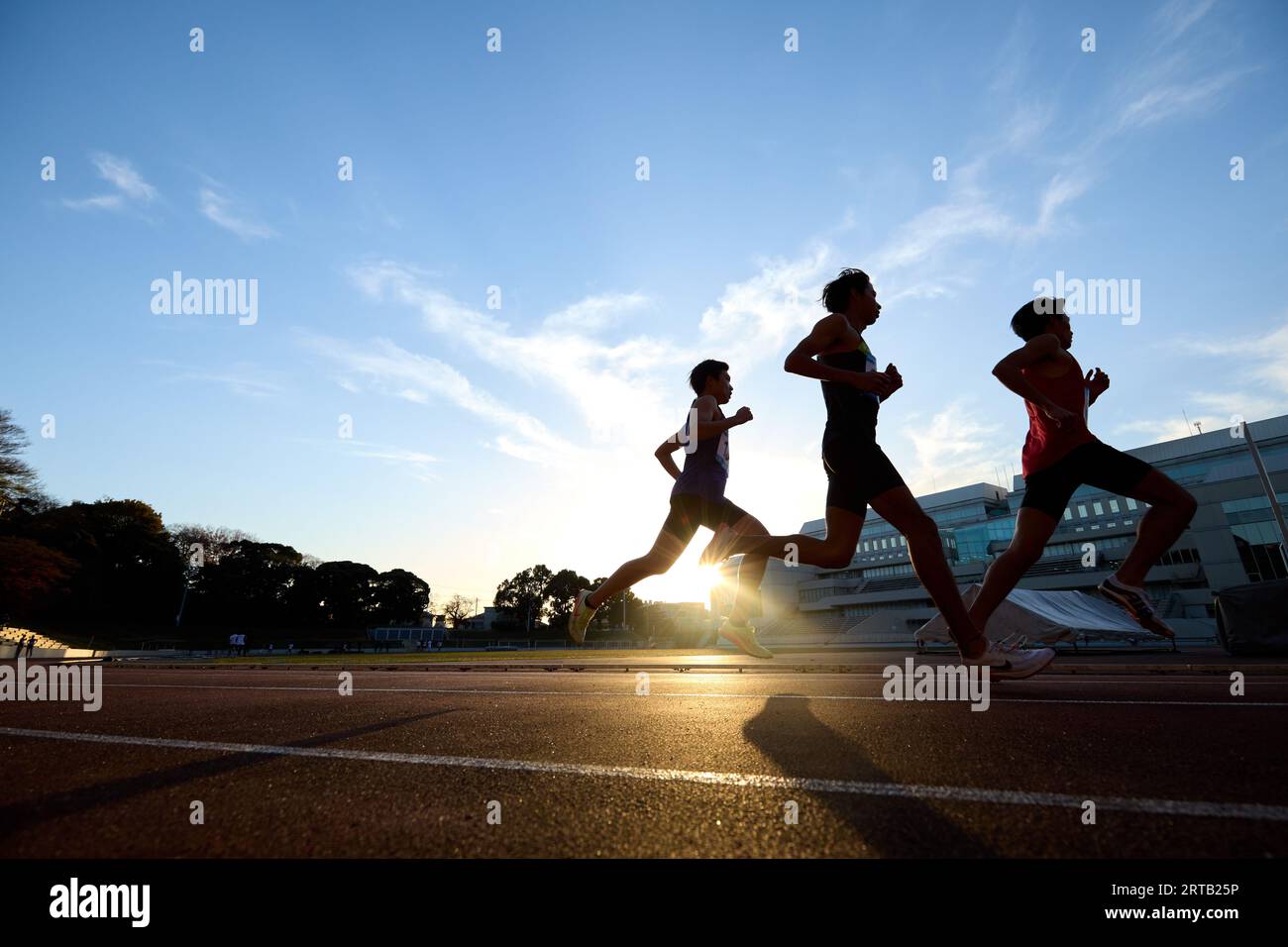 Japanese athletes running on track Stock Photo - Alamy