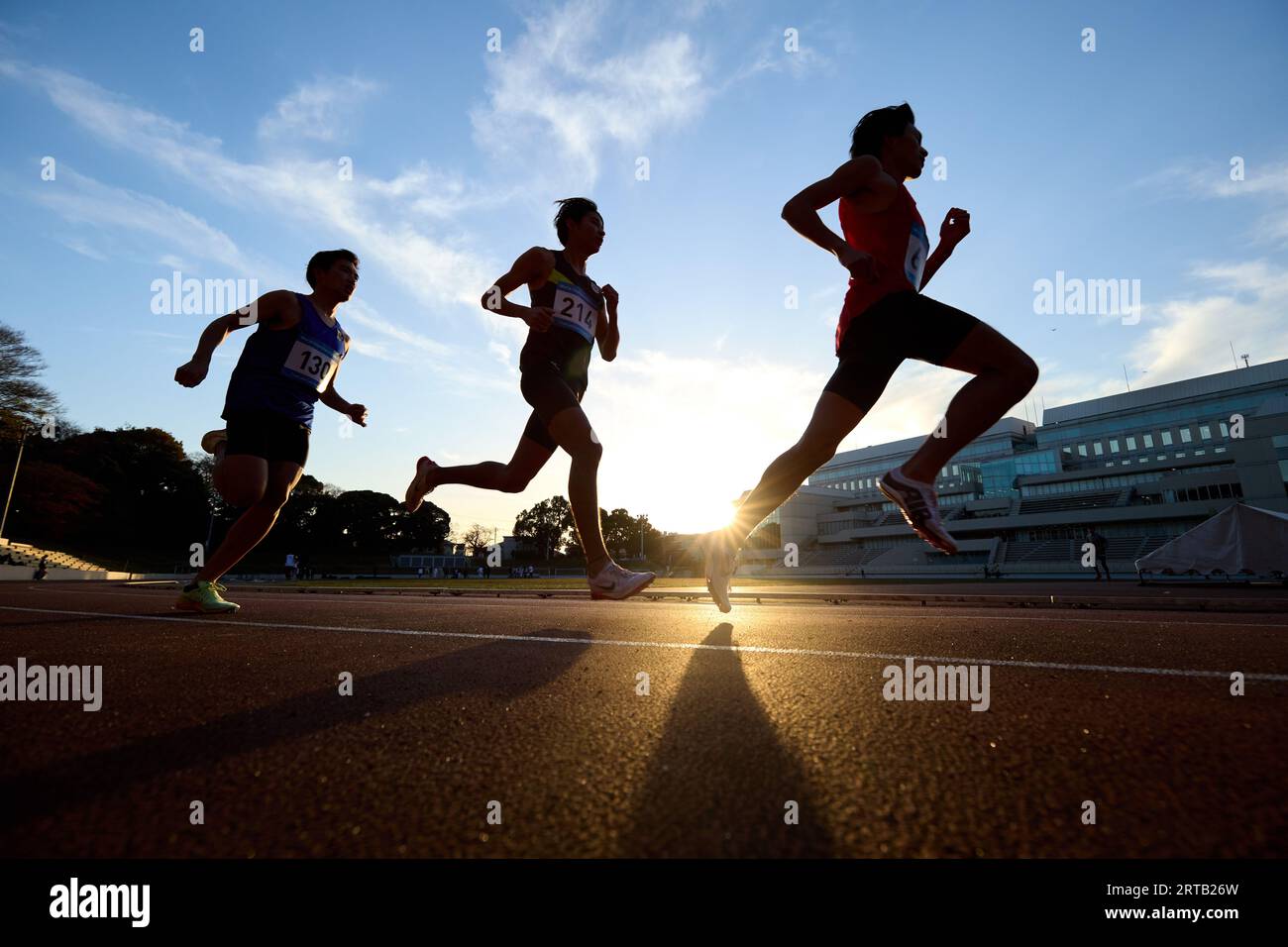 Japanese athletes running on track Stock Photo - Alamy