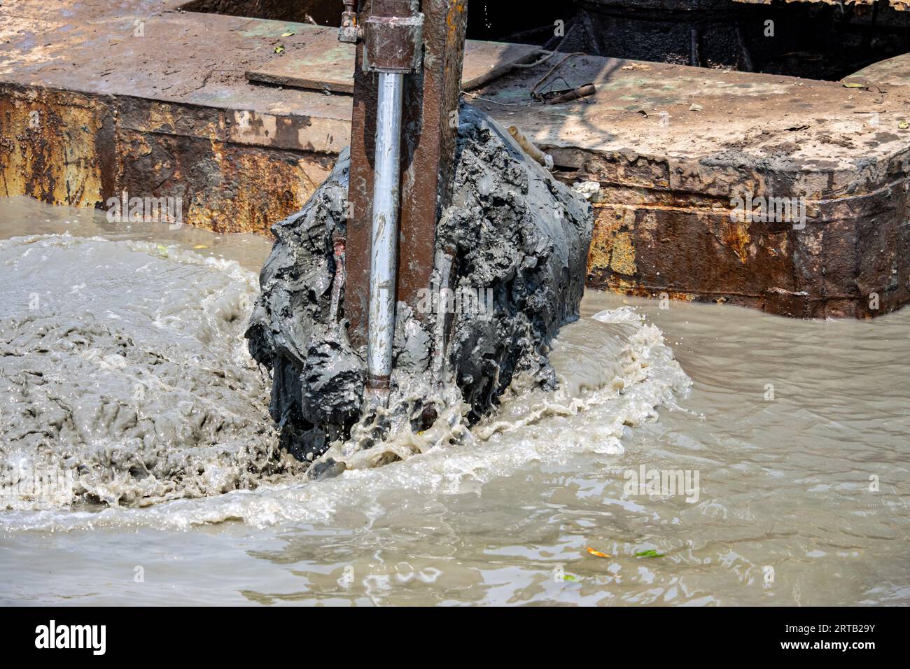 Dredging the bottom of water area, view of the bucket of the floating ...