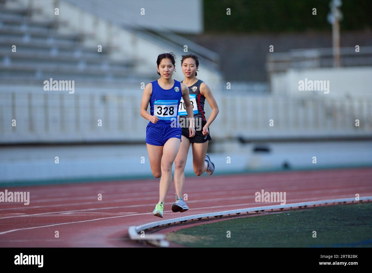 Japanese athletes running on track Stock Photo - Alamy