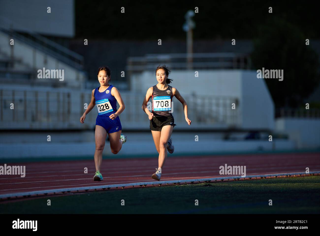 Japanese athletes running on track Stock Photo - Alamy