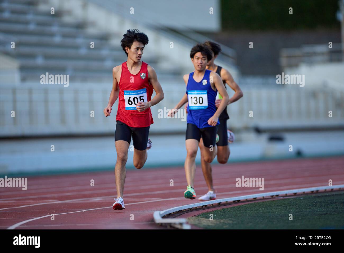 Japanese athletes running on track Stock Photo - Alamy