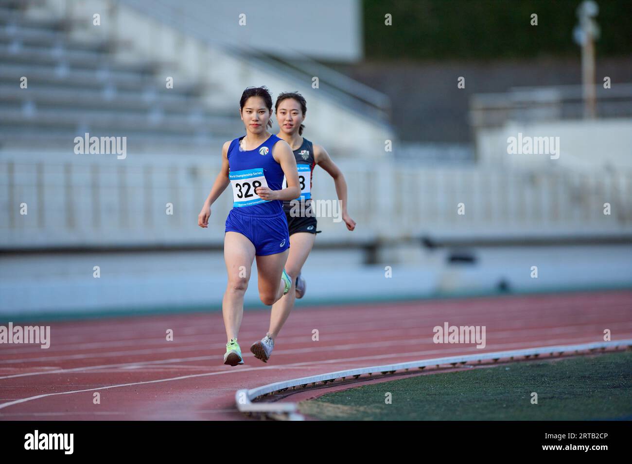 Japanese athletes running on track Stock Photo - Alamy