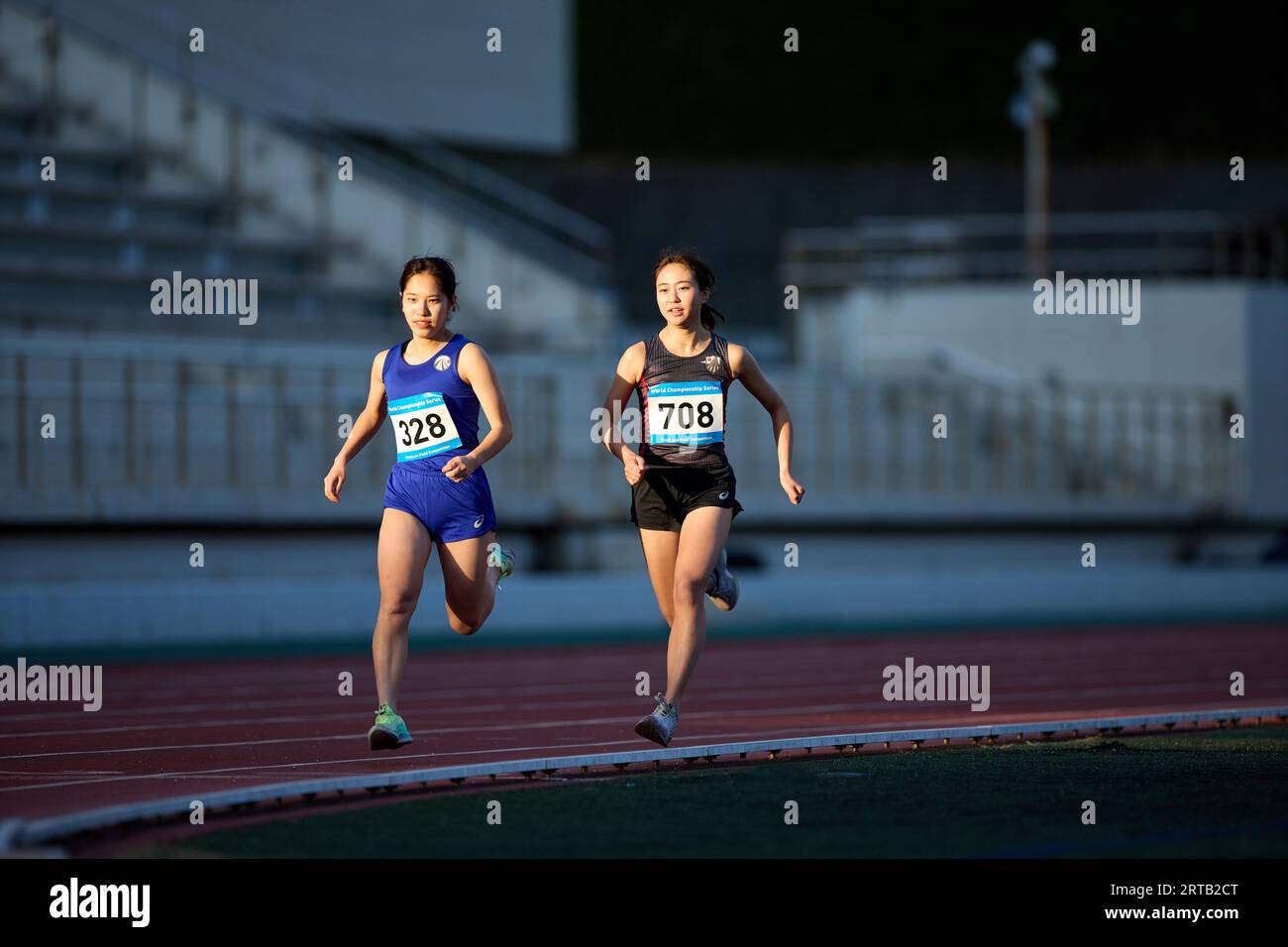 Japanese athletes running on track Stock Photo - Alamy