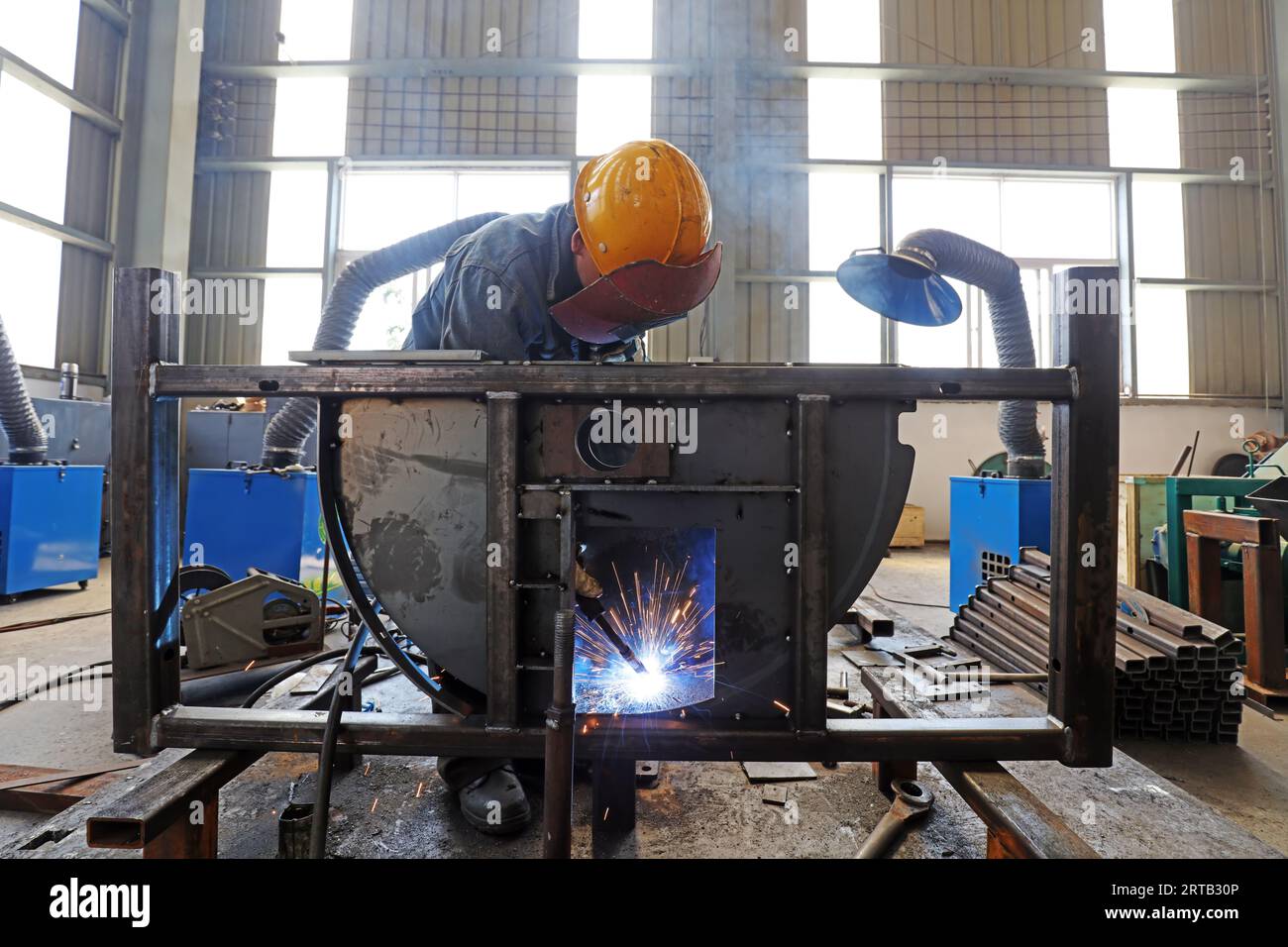 Welders are welding metal parts in the workshop Stock Photo - Alamy