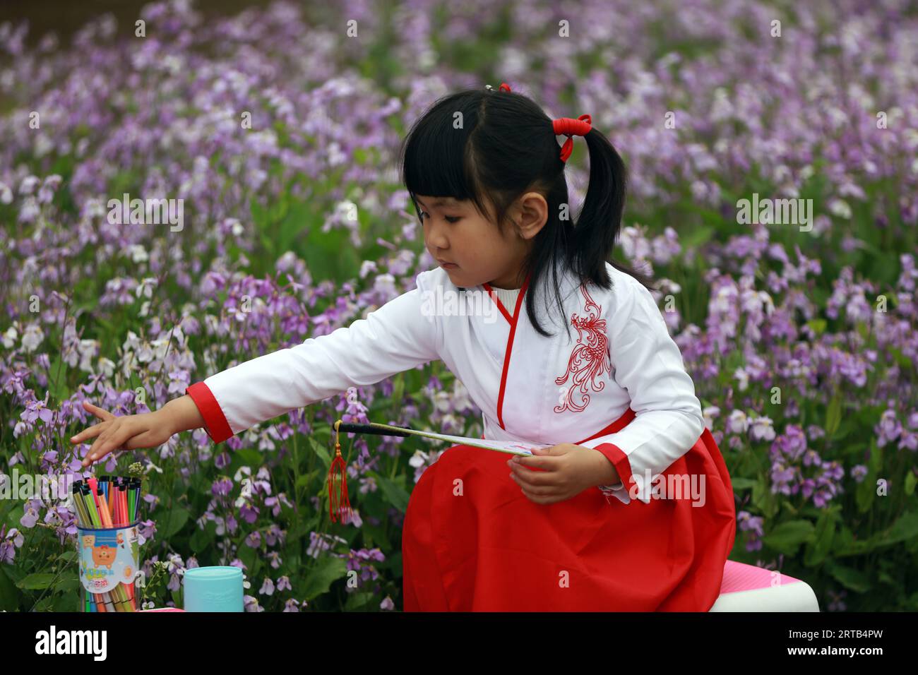 LUANNAN COUNTY, Hebei Province, China - April 27, 2019: A little girl ...