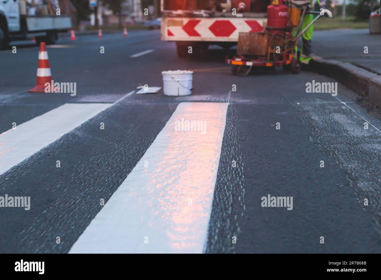 Process of making new road surface markings with a line striping ...
