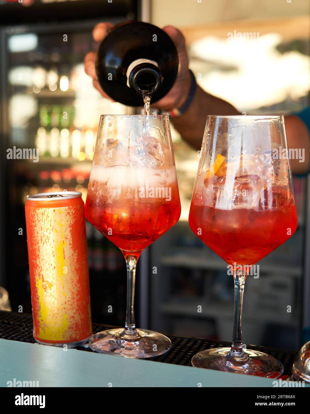Spritz traditional cocktail with alcohol being prepared in a beach bar ...