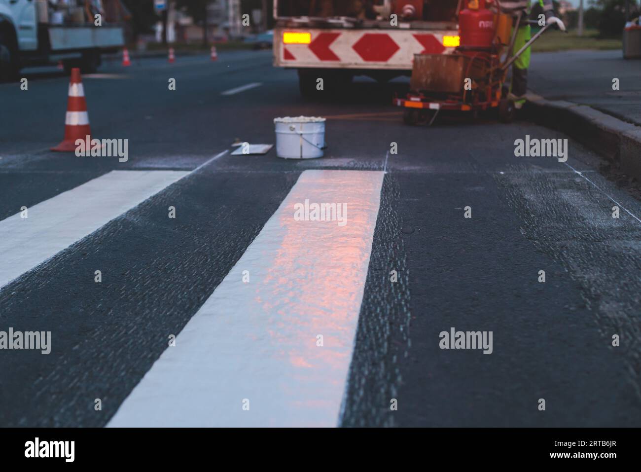 Process of making new road surface markings with a line striping ...