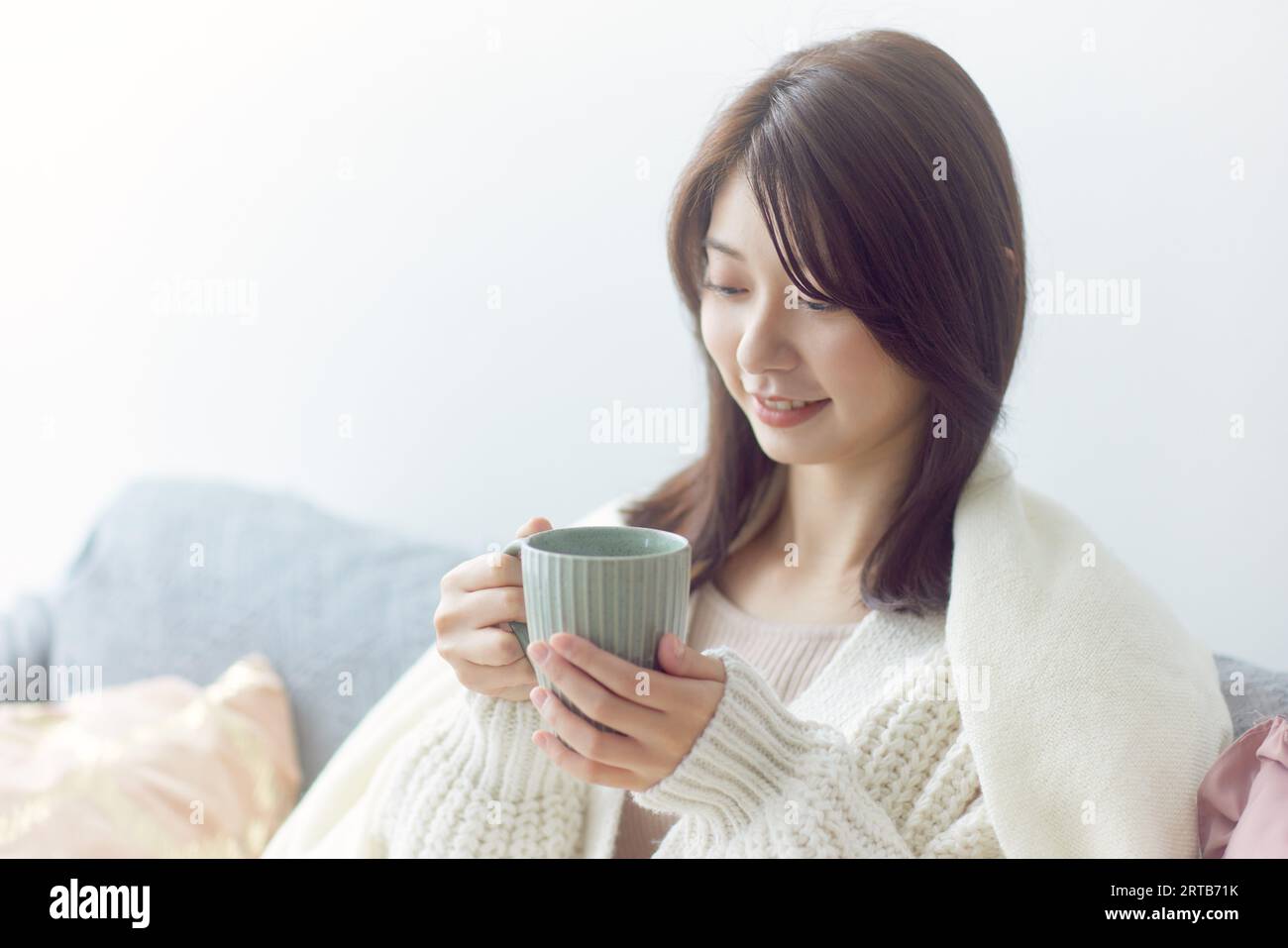Japanese woman relaxing at home Stock Photo - Alamy