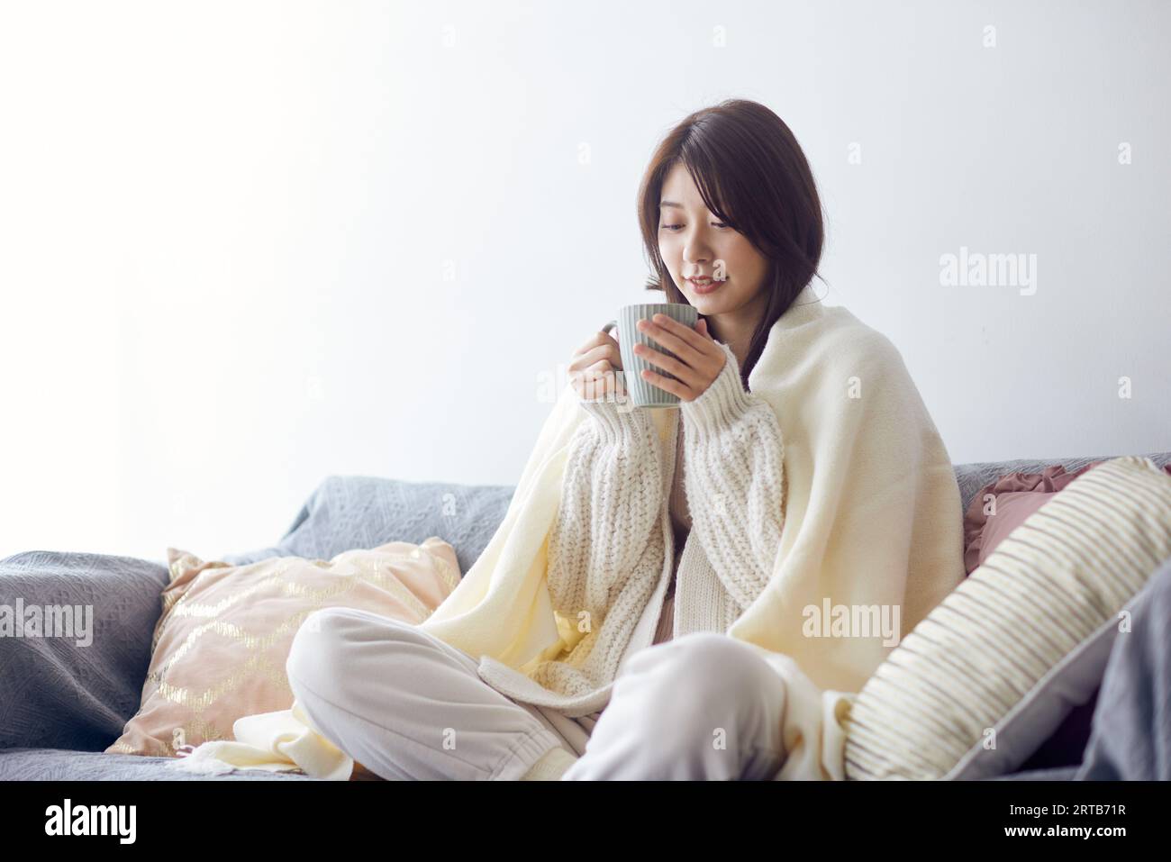 Japanese woman relaxing at home Stock Photo - Alamy
