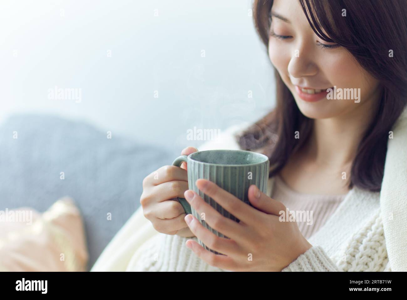 Japanese woman relaxing at home Stock Photo - Alamy