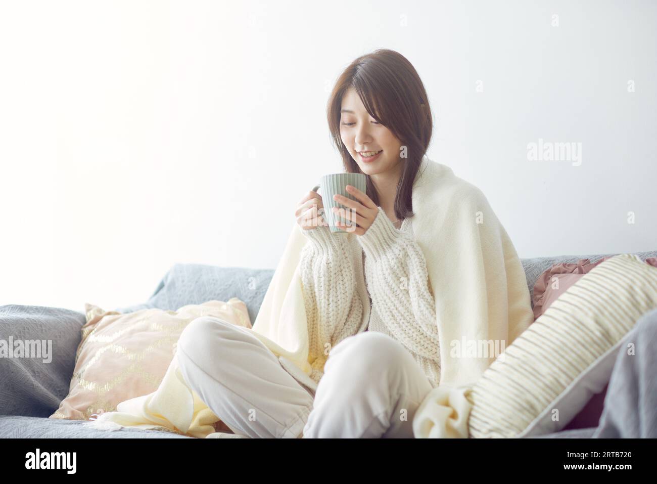 Japanese woman relaxing at home Stock Photo - Alamy