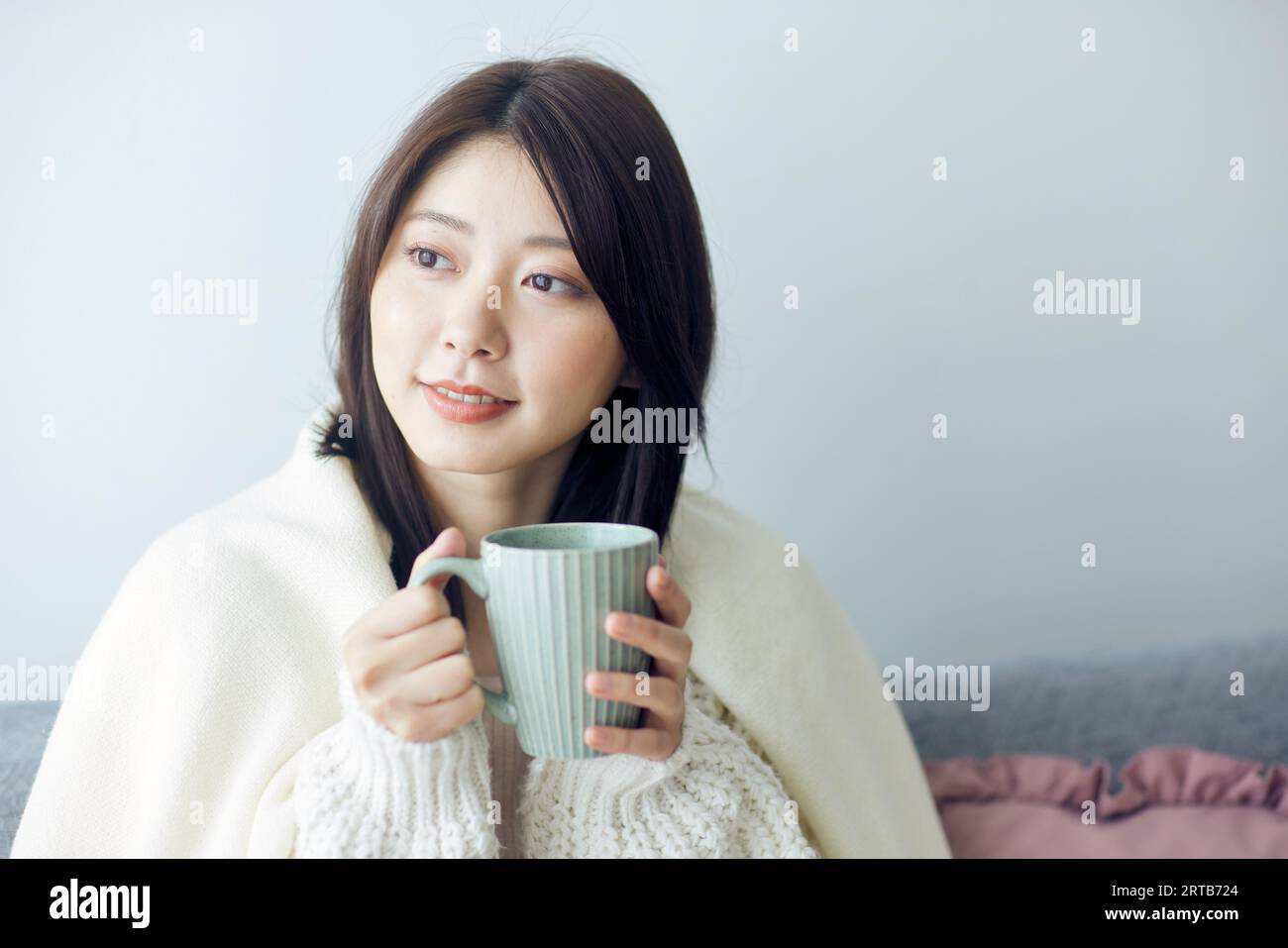 Japanese woman relaxing at home Stock Photo - Alamy