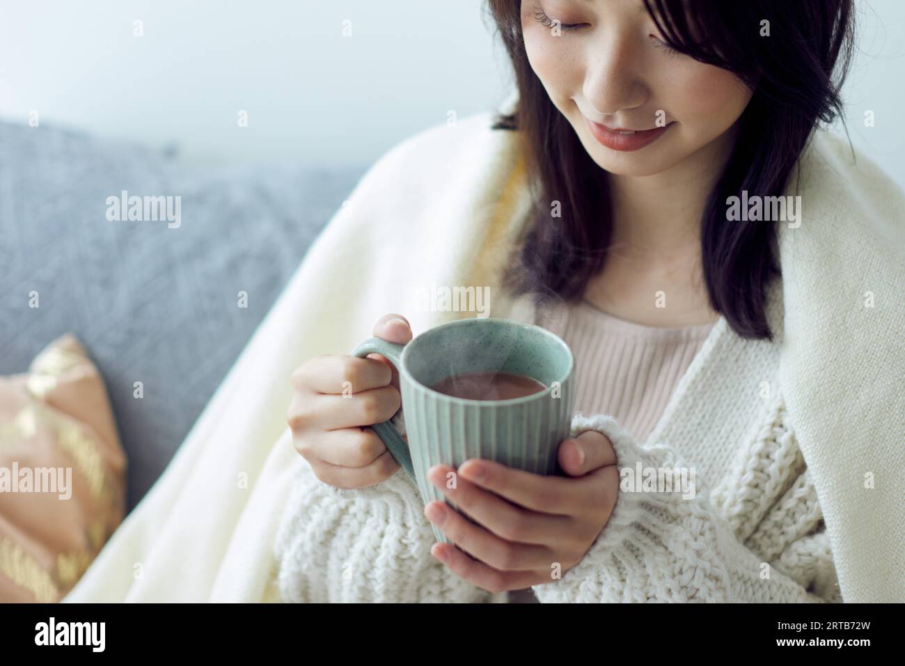 Japanese woman relaxing at home Stock Photo - Alamy