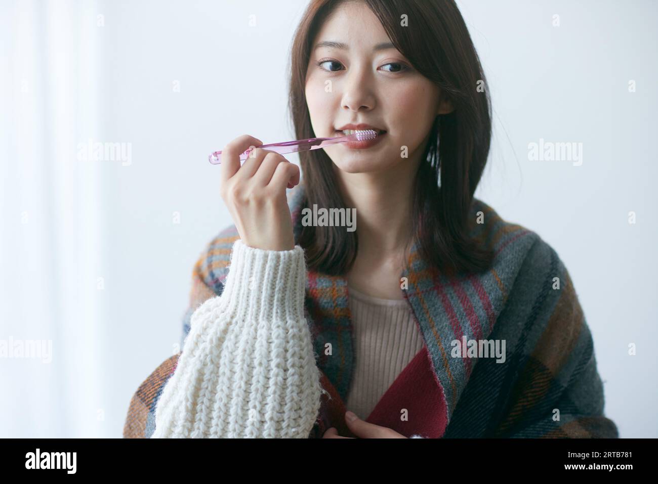 Japanese woman relaxing at home Stock Photo - Alamy
