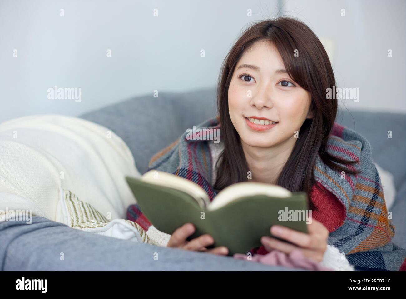 Asian woman relaxing reading book hi-res stock photography and images - Alamy