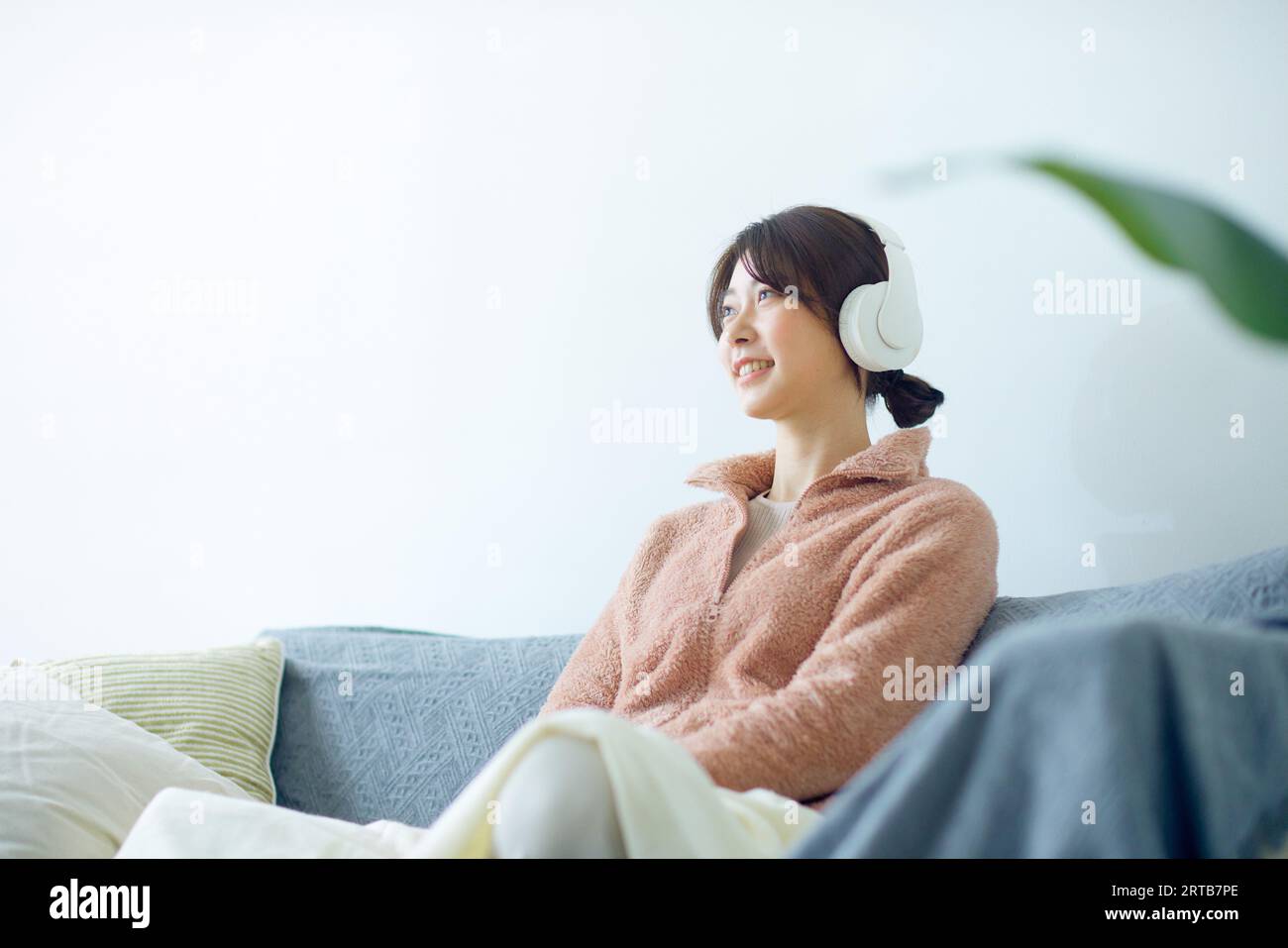 Japanese woman relaxing at home Stock Photo - Alamy