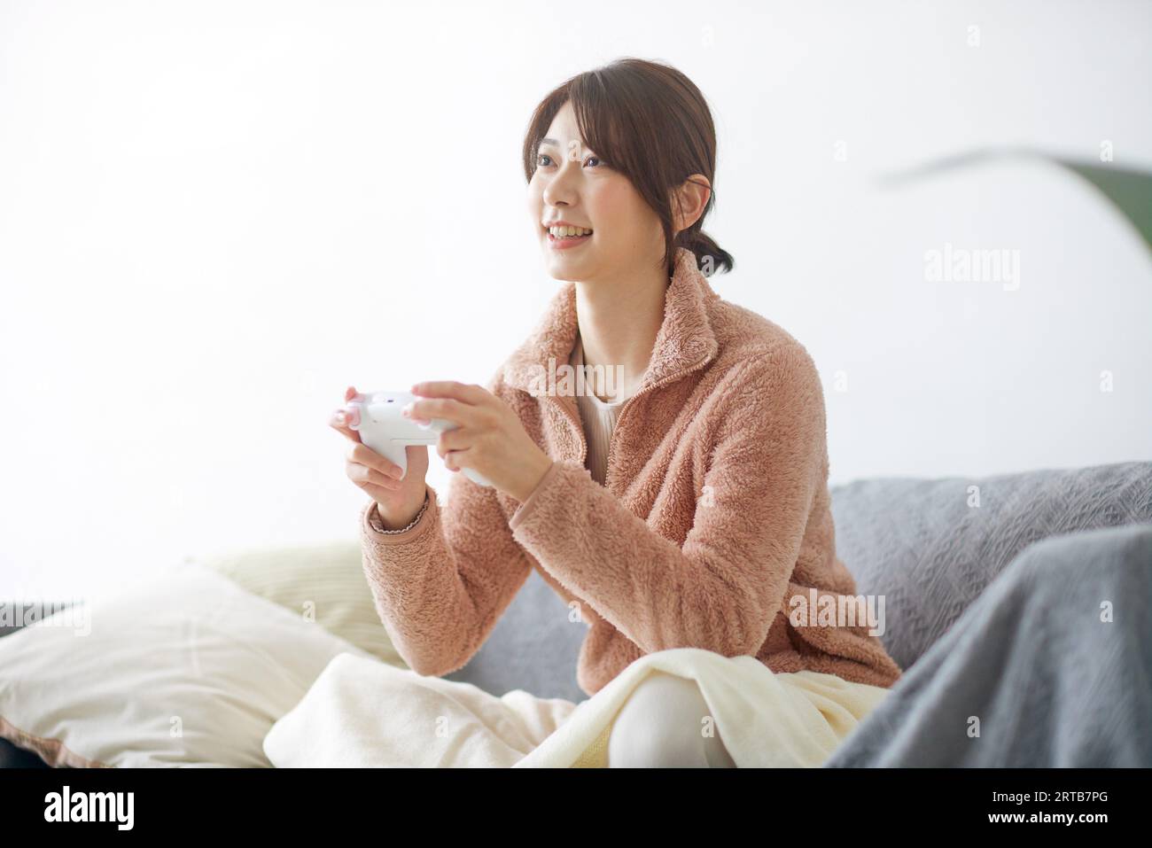Japanese woman relaxing at home Stock Photo - Alamy