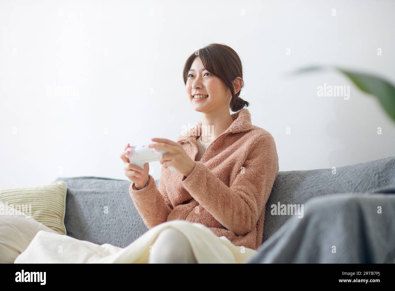 Japanese woman relaxing at home Stock Photo - Alamy