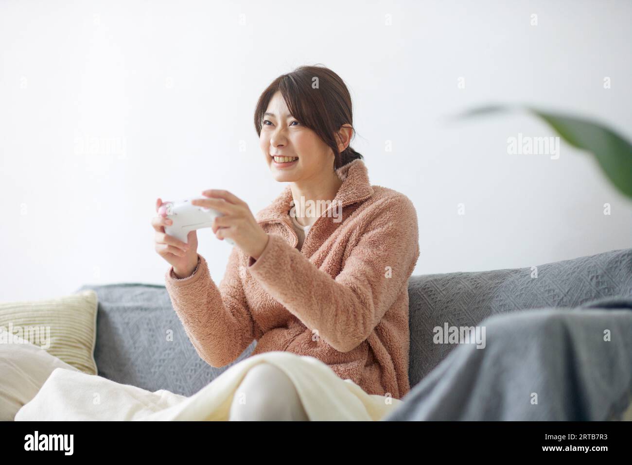 Japanese woman relaxing at home Stock Photo - Alamy