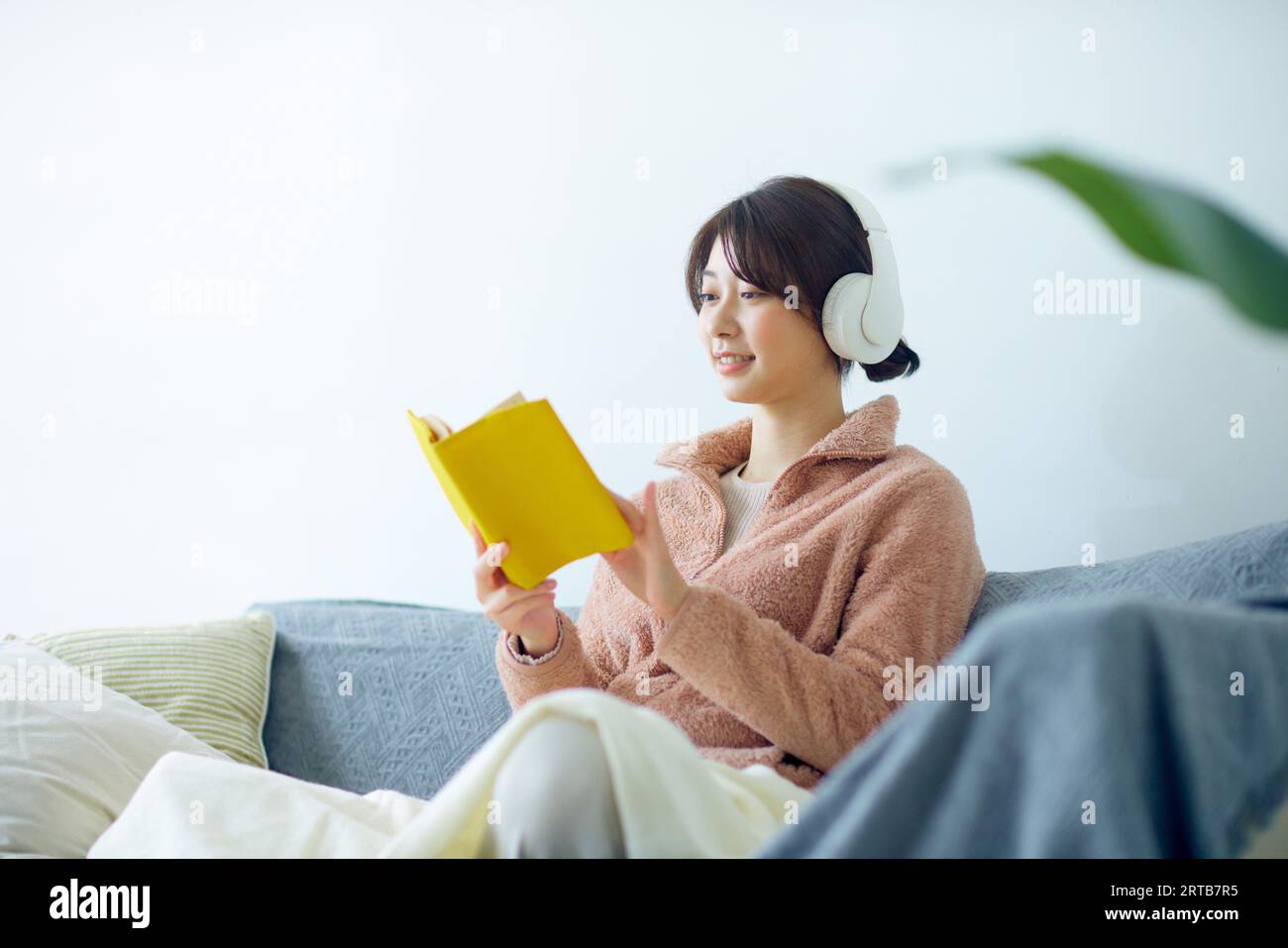 Japanese woman relaxing at home Stock Photo - Alamy