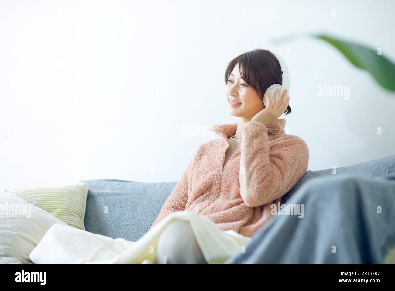 Japanese woman relaxing at home Stock Photo - Alamy