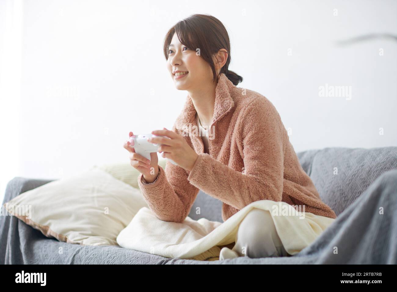 Japanese woman relaxing at home Stock Photo - Alamy