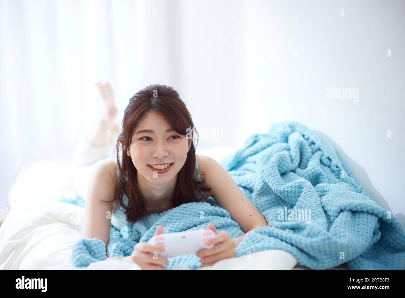 Japanese woman relaxing at home Stock Photo - Alamy