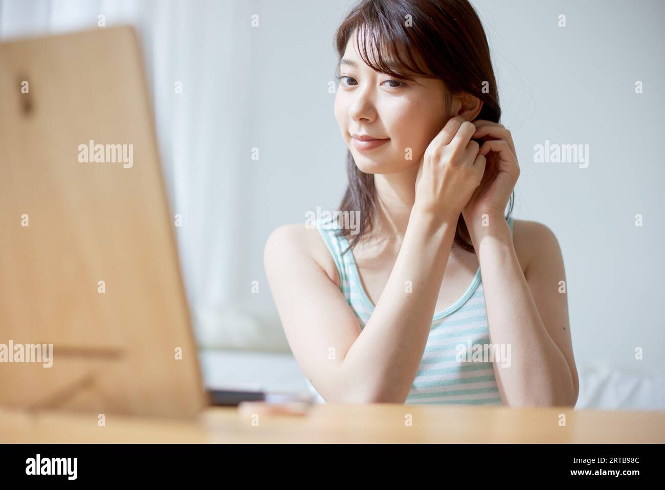 Japanese woman relaxing at home Stock Photo - Alamy