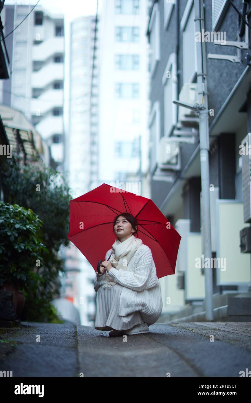 Woman crouching sit hi-res stock photography and images - Alamy