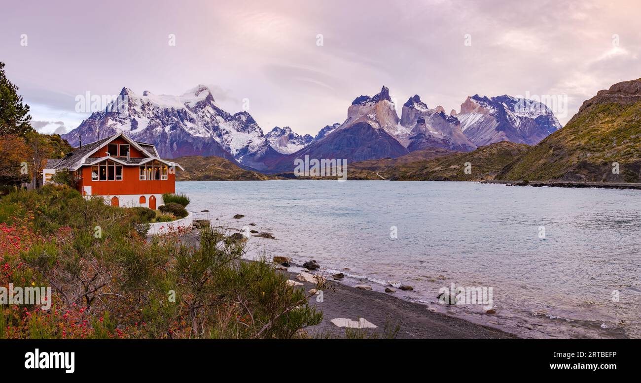 The hotel on Lake Pehoe as a panorama on the Torres del Paine massif in ...