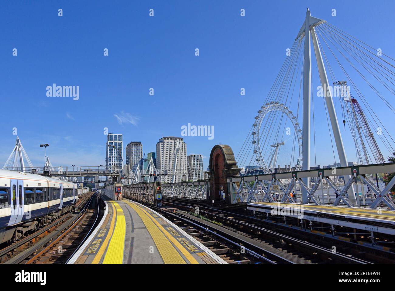 London, UK. Charing Cross Station - end of a platform with a view of ...