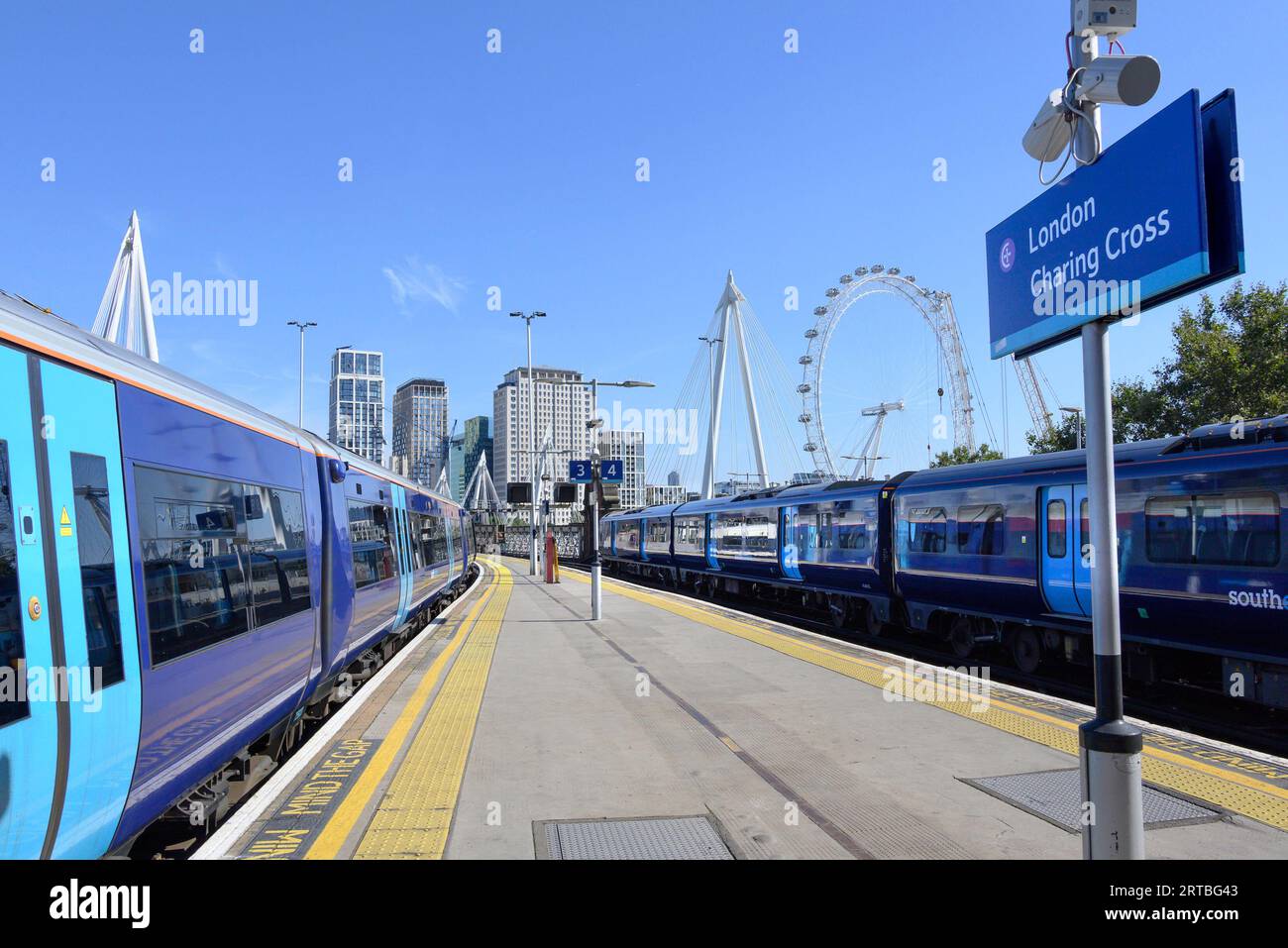 London, UK. Charing Cross Station - end of a platform with a view of ...