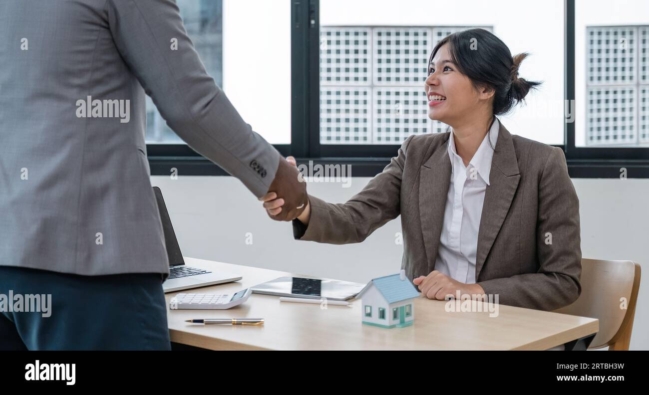 Real estate agent African American handshake to customer business woman ...