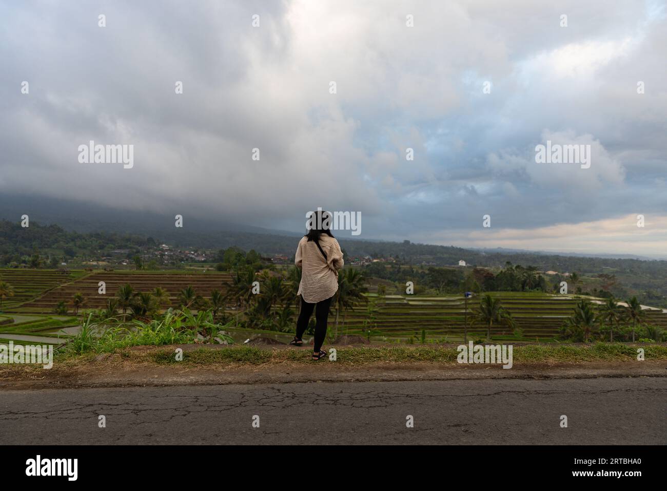 An Indonesian girl taking in the breathtaking landscapes of the UNESCO ...