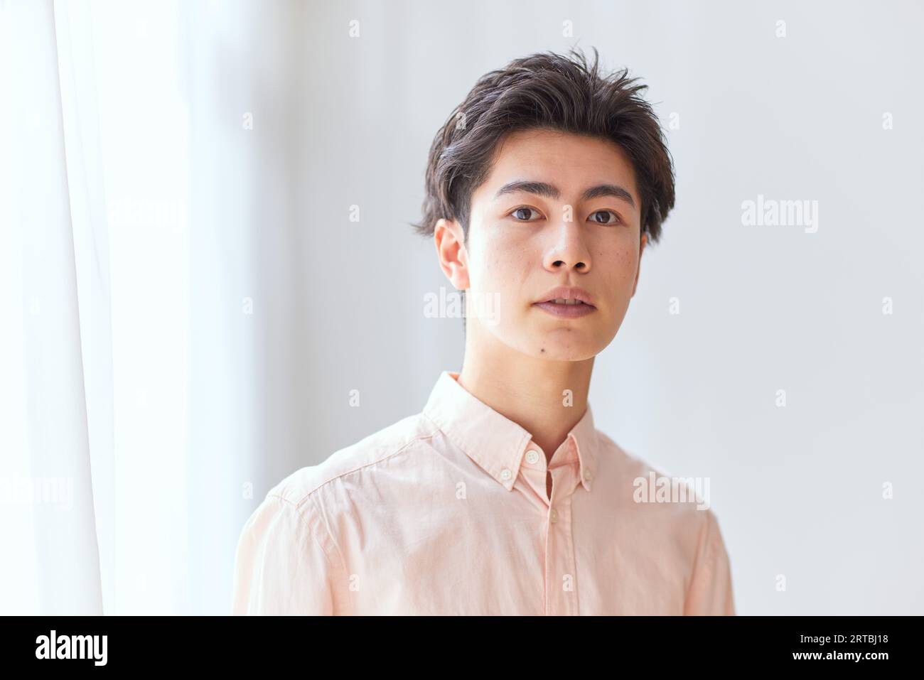 Japanese man relaxing at home Stock Photo - Alamy