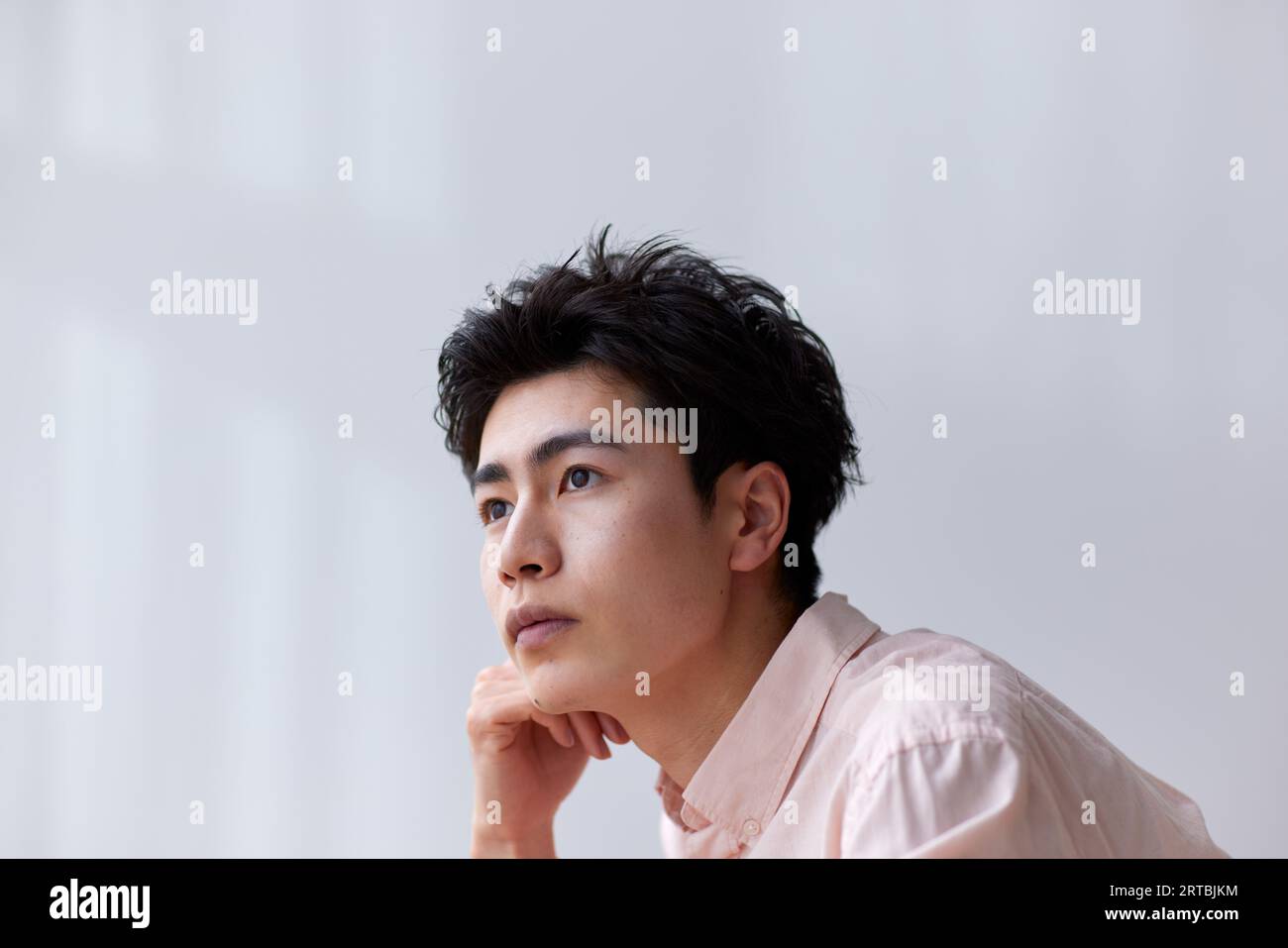 Japanese man relaxing at home Stock Photo - Alamy