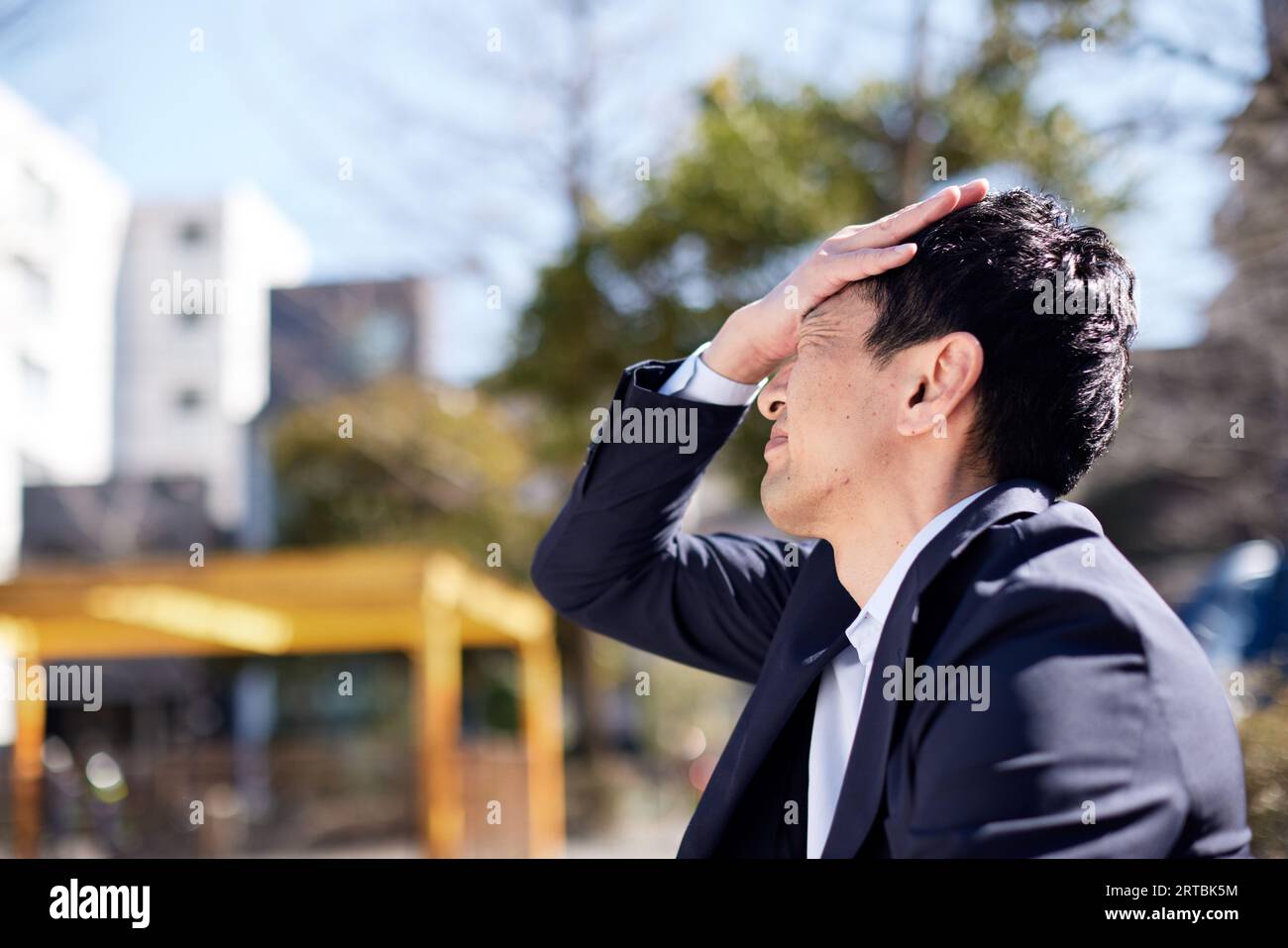 Stressed Japanese man Stock Photo - Alamy