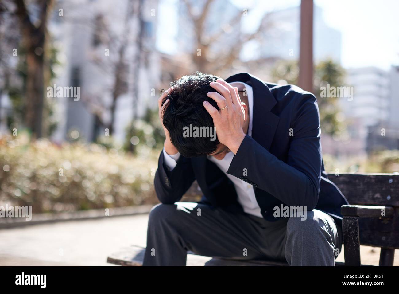 Stressed Japanese man Stock Photo - Alamy