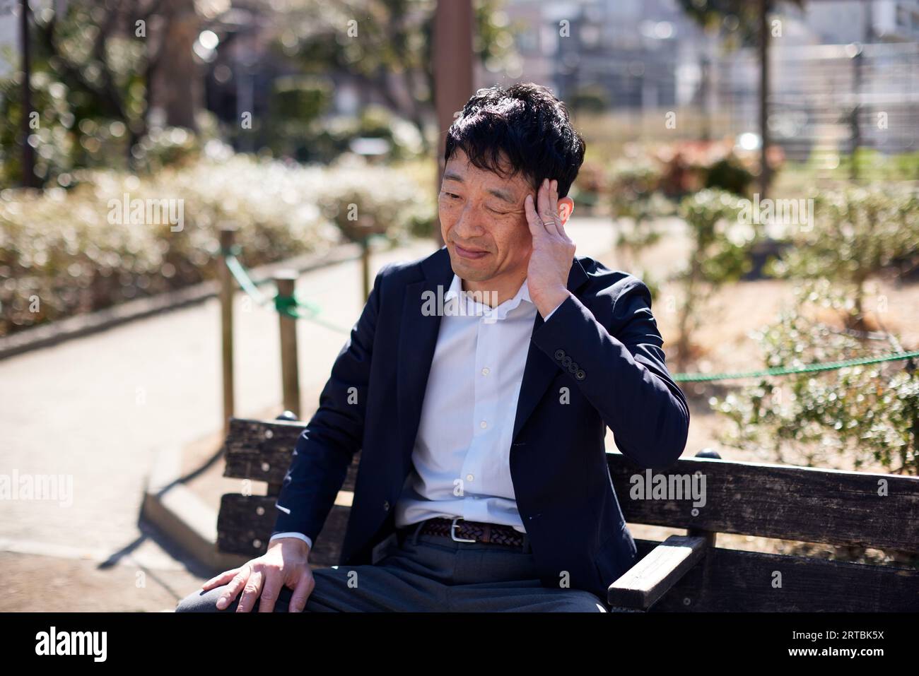 Stressed Japanese man Stock Photo - Alamy